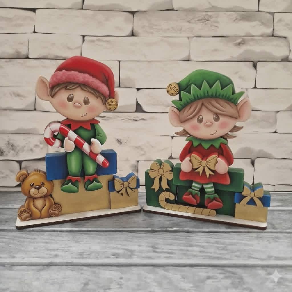 Mini elves on presents to help Sofa Santa