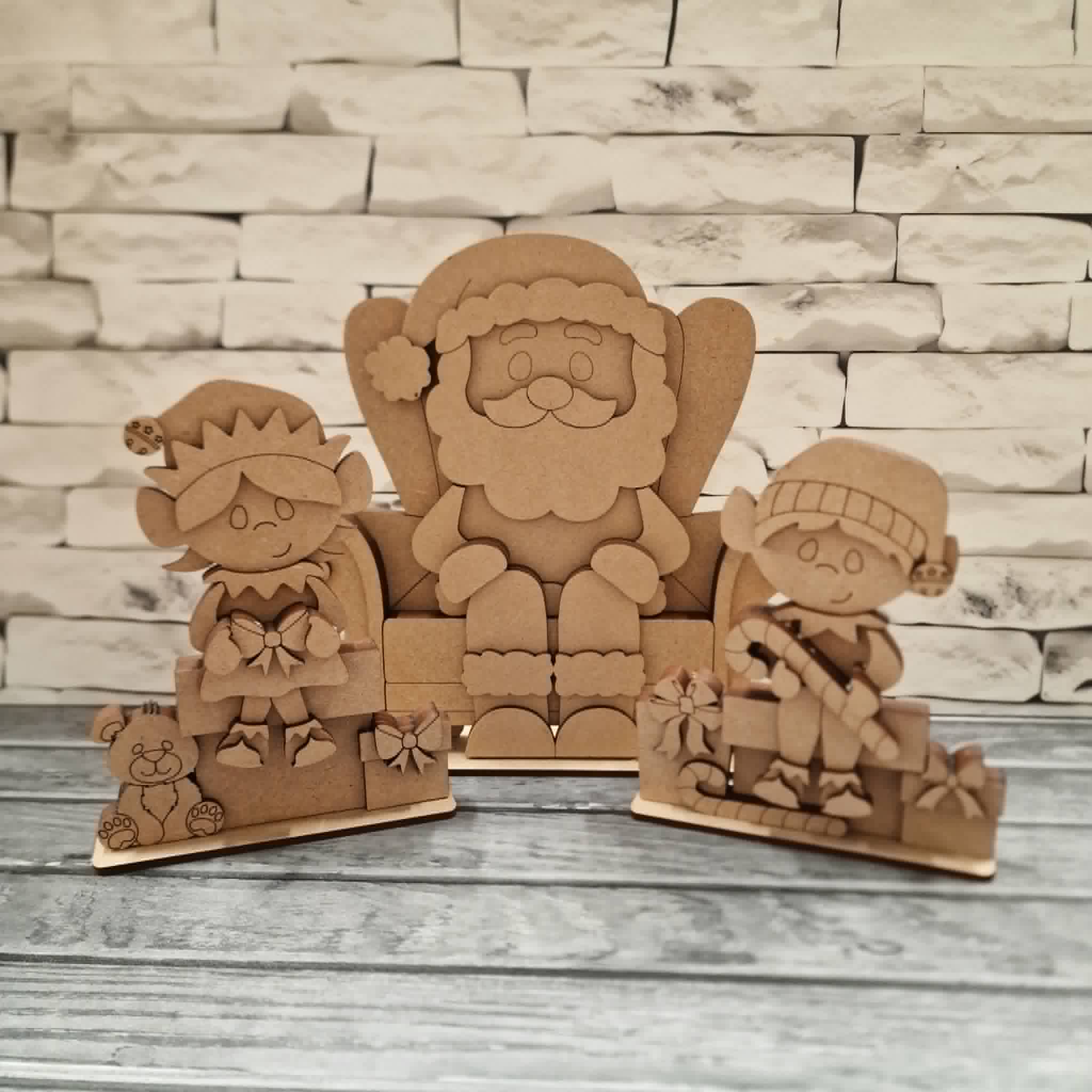Mini elves on presents to help Sofa Santa